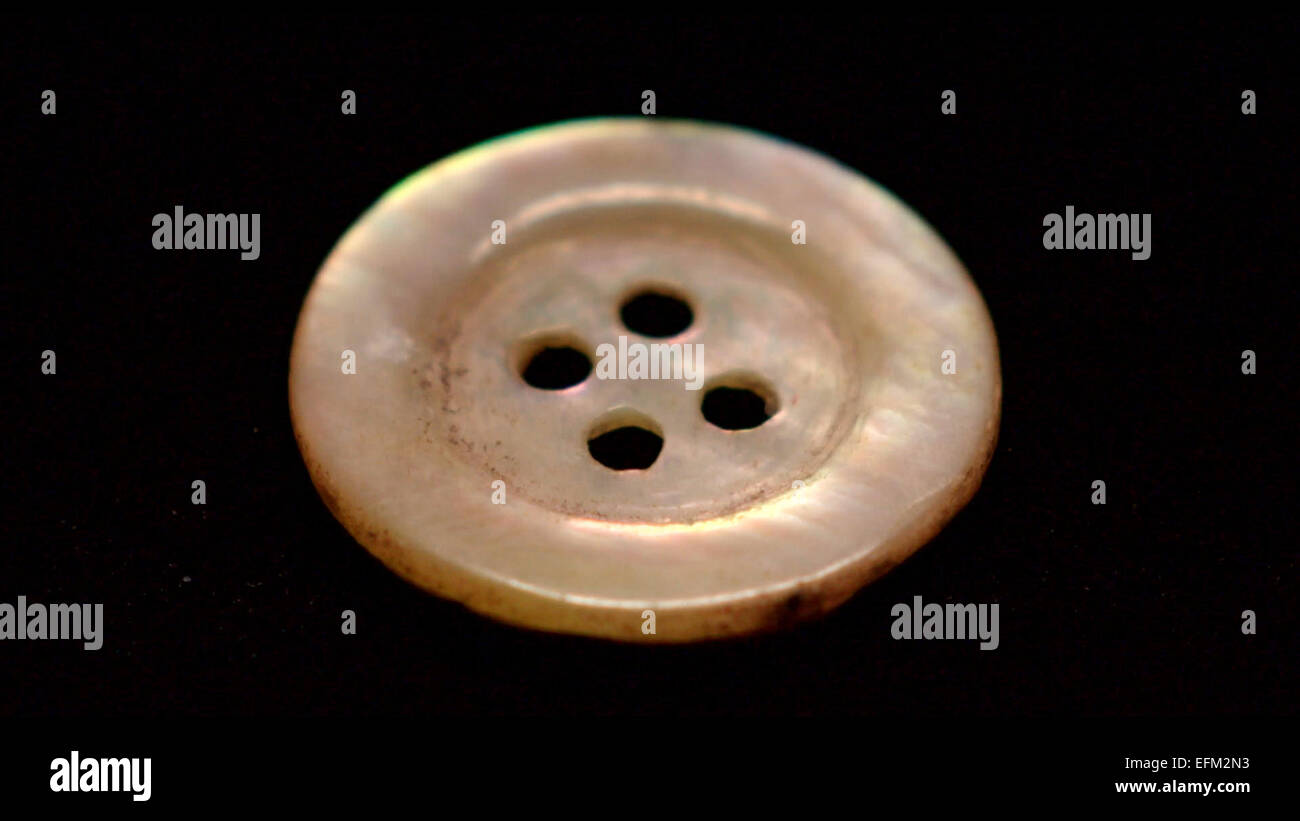 An undated handout picture shows a pearl button in a still from the ...