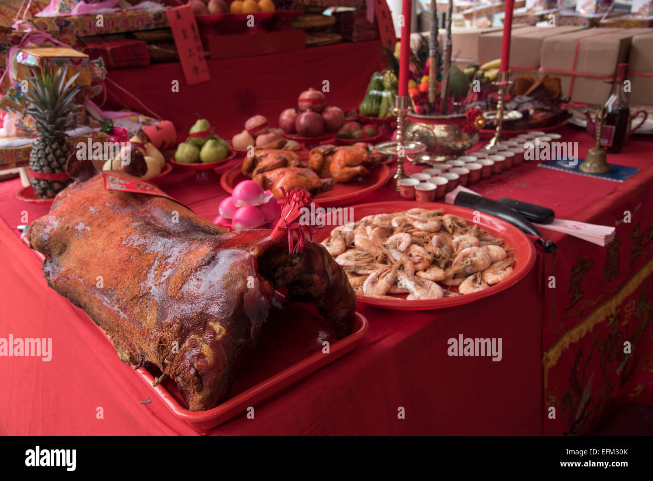 Preparations for Chinese New Year in Singapore. Food offerings in altar ...