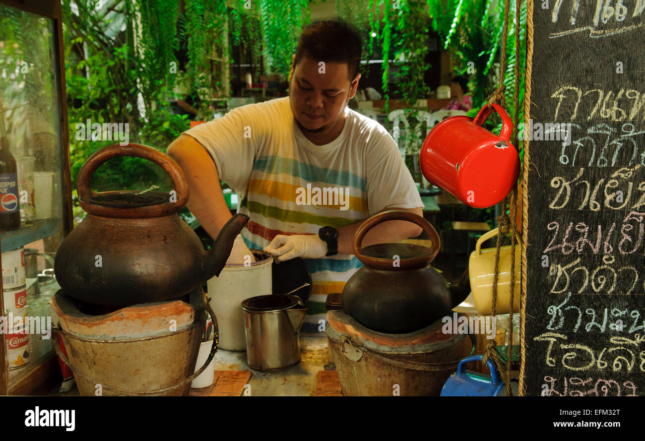 Man Making Coffee the traditional way at Koh Kret Thailand Stock Photo ...