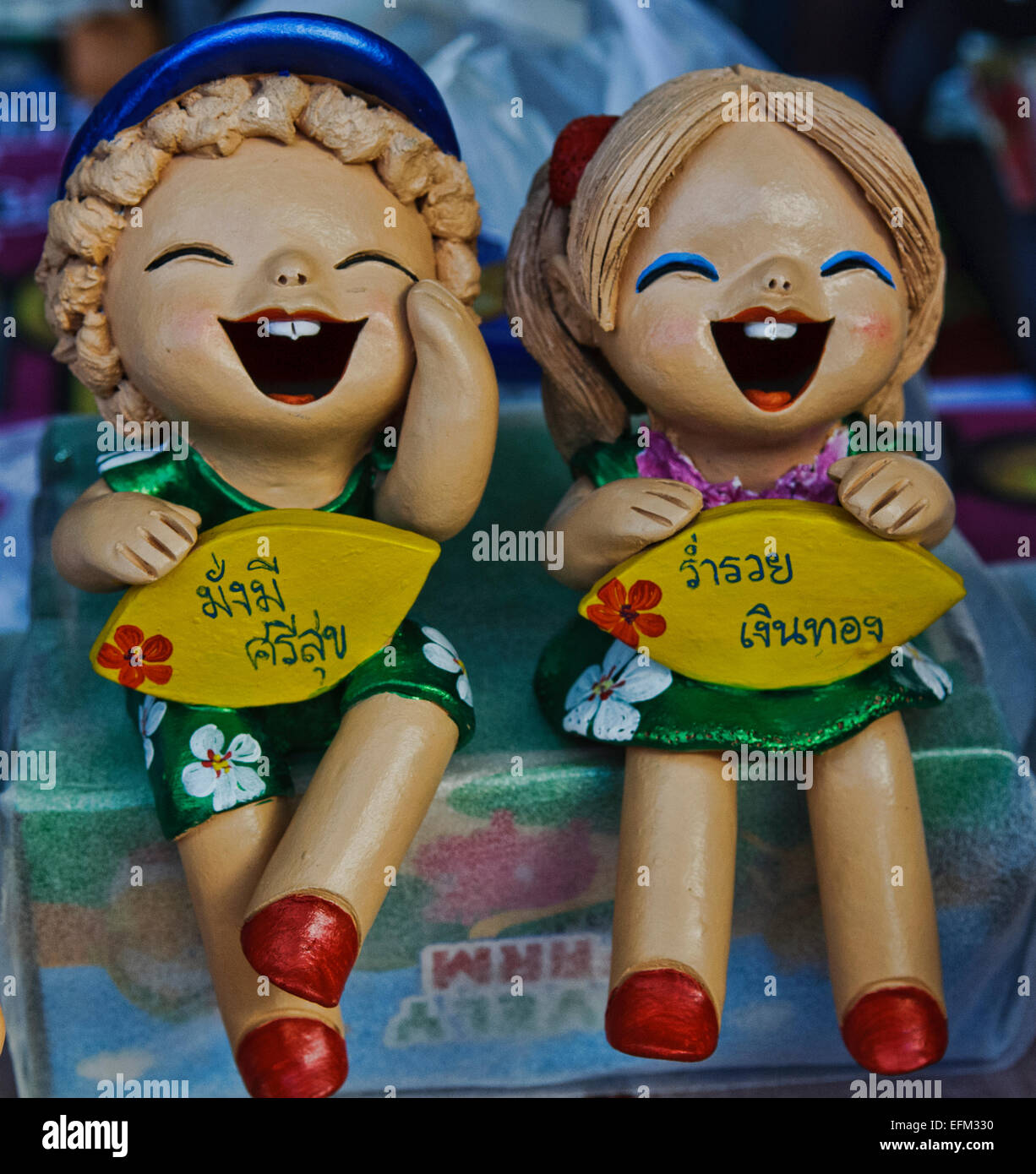 Happy girl and boy figurine Stock Photo - Alamy