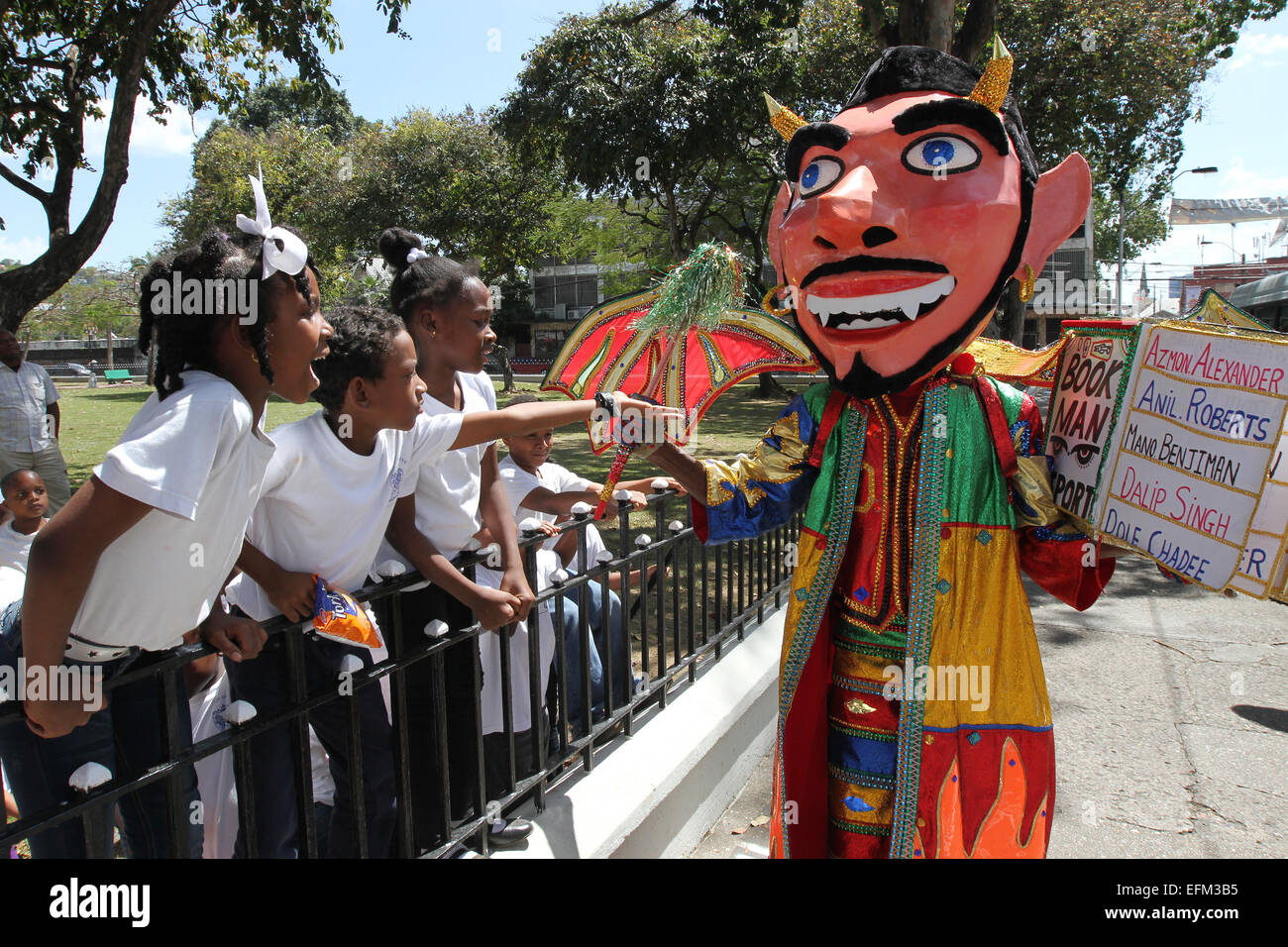 A Book Man character performs for children along Frederick Street ...