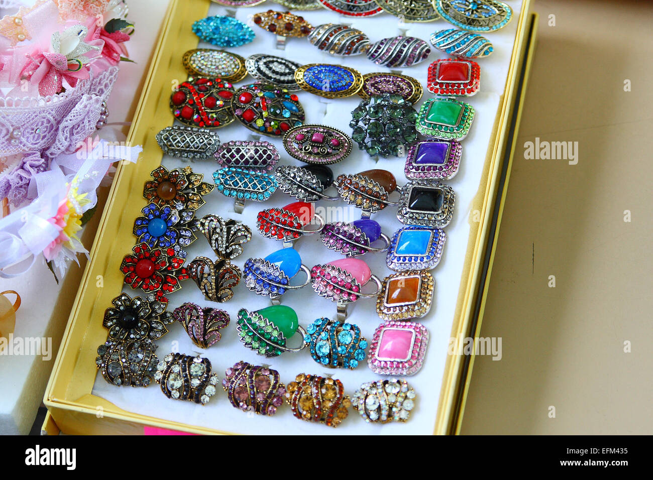 Colorful Jewelry, Rings on display at market stall Stock Photo - Alamy