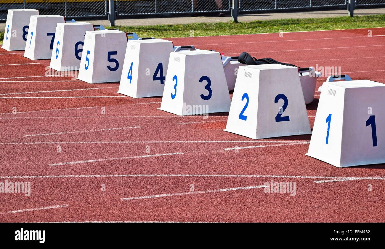 Starting blocks at the starting line of the running track Stock Photo ...