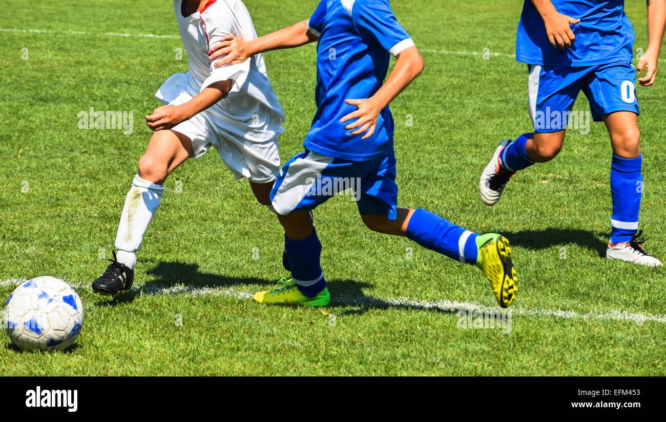Soccer players are playing football Stock Photo - Alamy