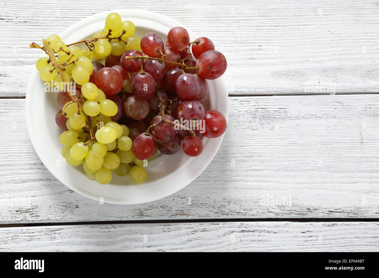 Grapes on a plate, food Stock Photo - Alamy
