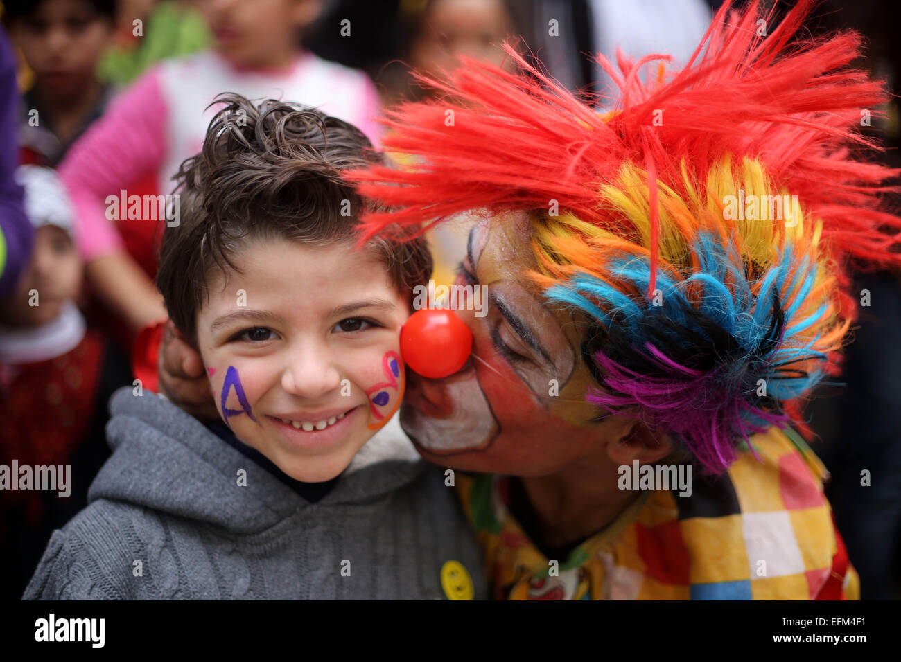 Gaza City, Gaza Strip. 6th Feb, 2015. A clown kisses a Palestinian boy ...