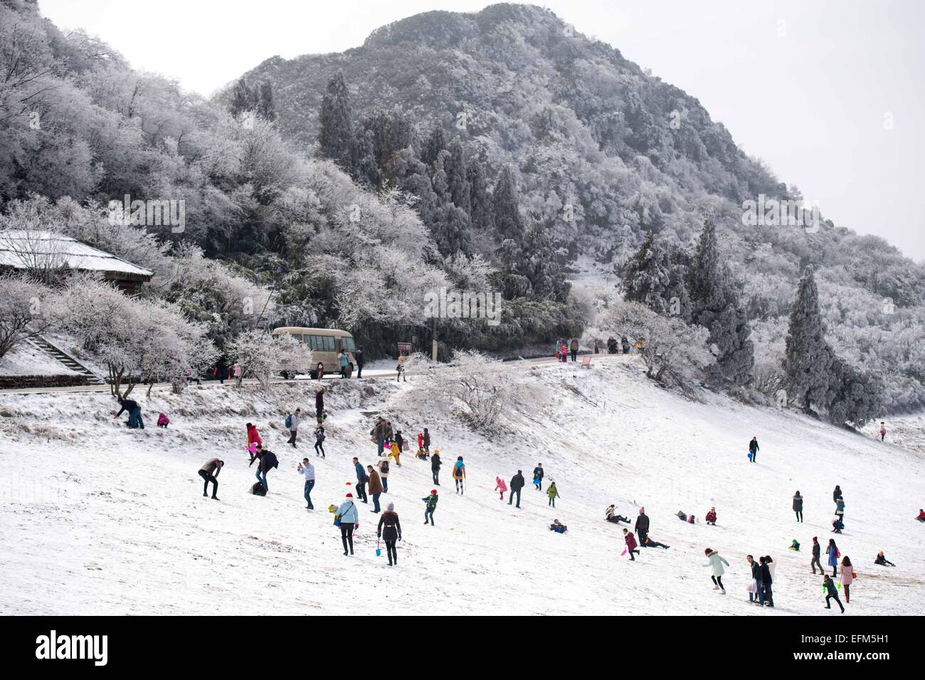 Chongqing. 6th Feb, 2015. Tourists play in the snow-covered Jinfo ...