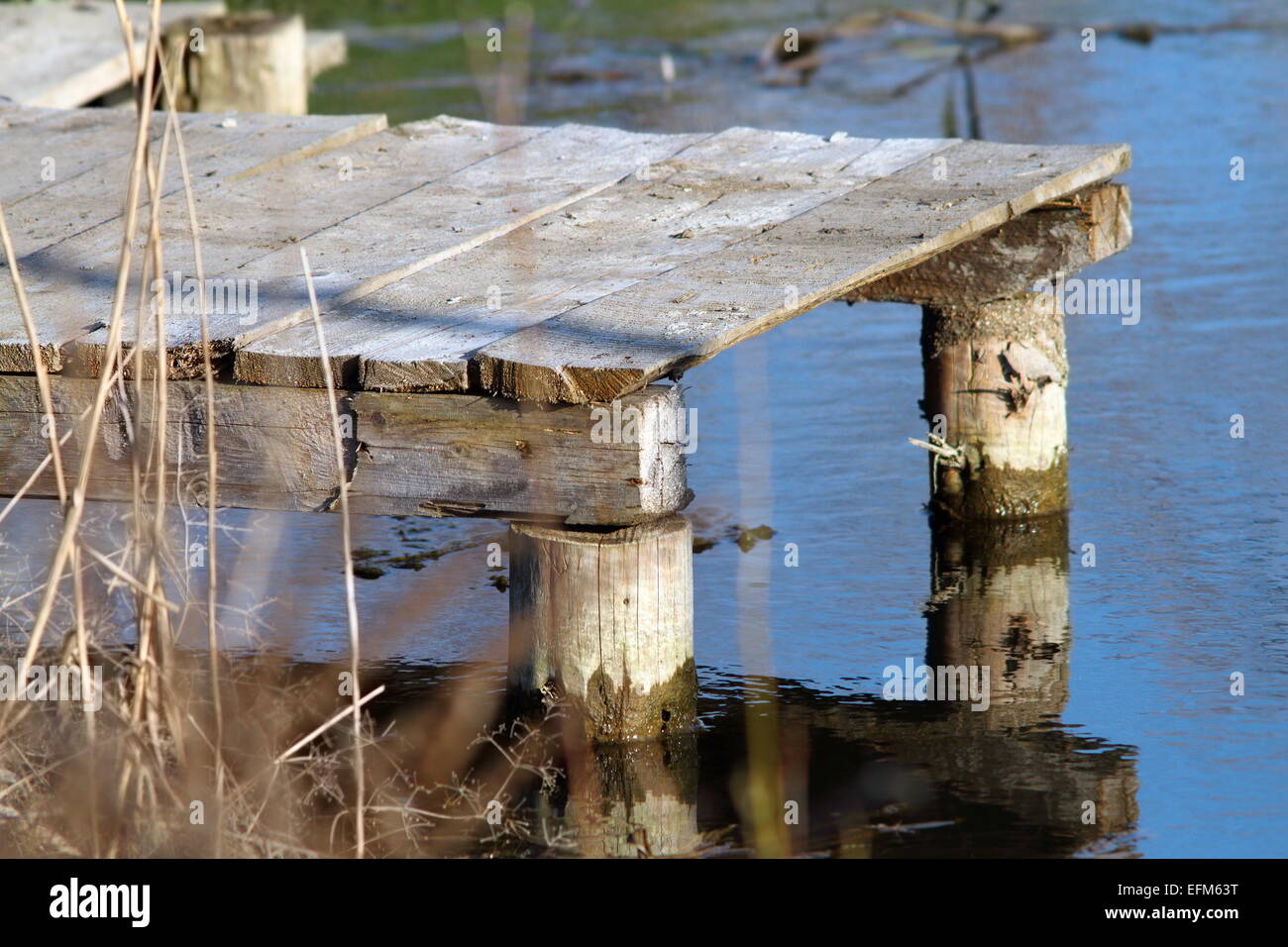small wooden pontoon for fishing in a pond Stock Photo - Alamy