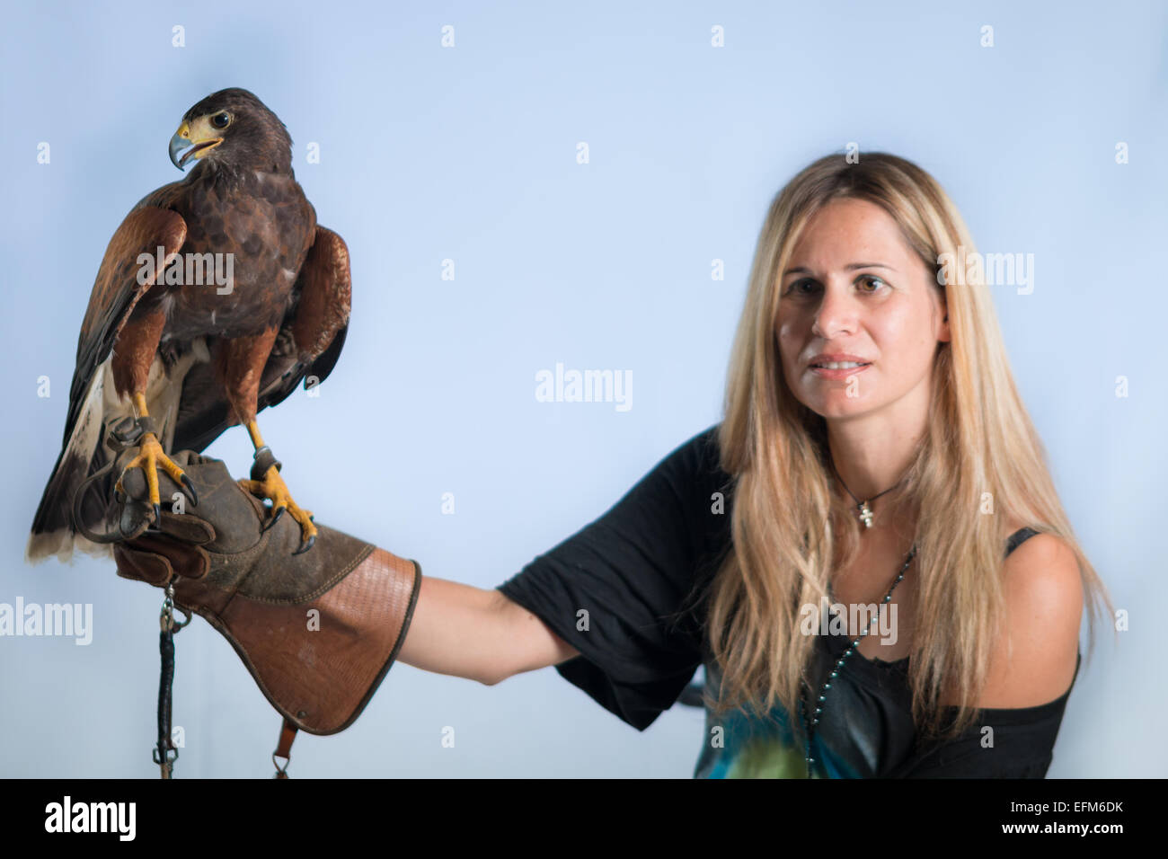 Woman and buzzard Stock Photo - Alamy