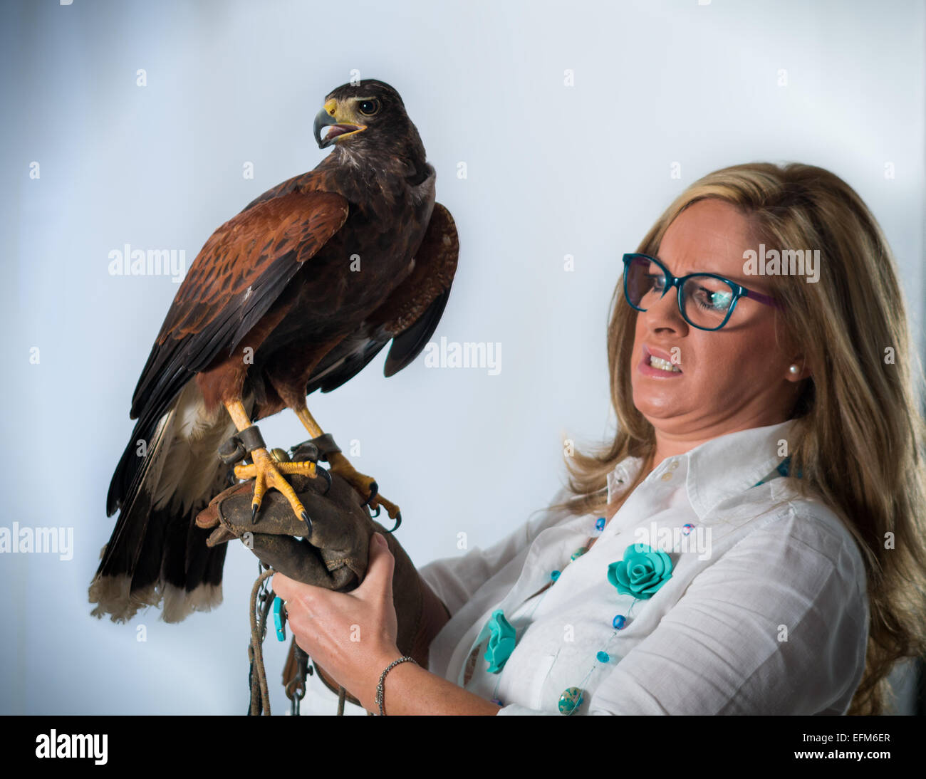 Woman and buzzard Stock Photo - Alamy