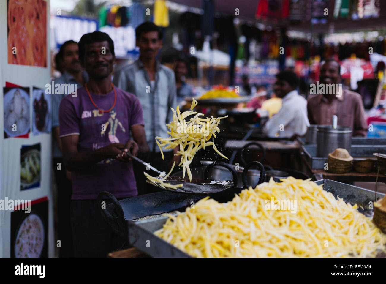 A local vendor prepares French Fries at Numaish,an industrial ...