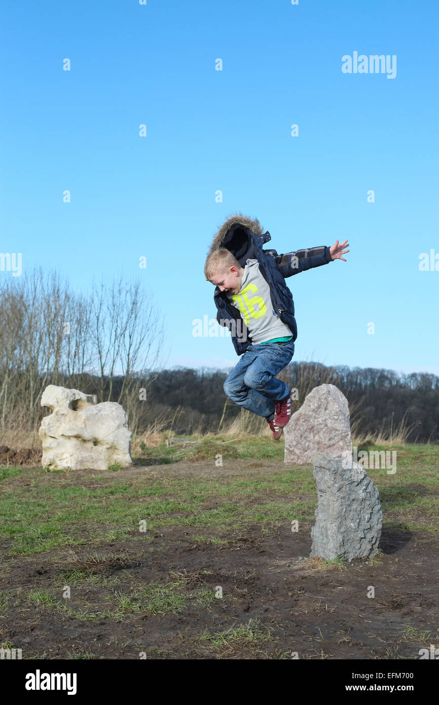 Child leaping hi-res stock photography and images - Alamy