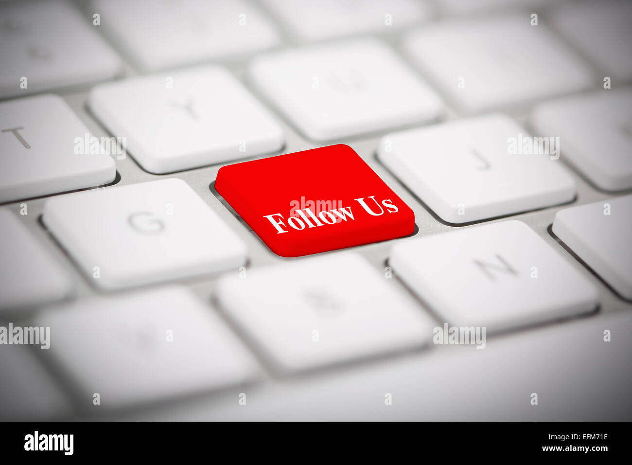 "Follow Us" written on metallic keyboard Stock Photo - Alamy