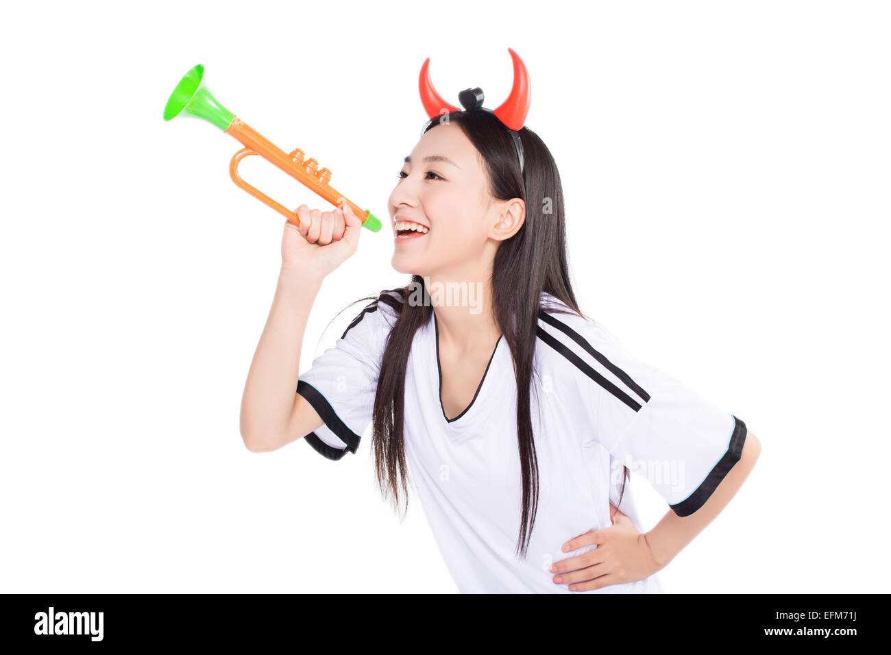 uniformed cheerleader a pose with a megaphone isolated on white Stock ...