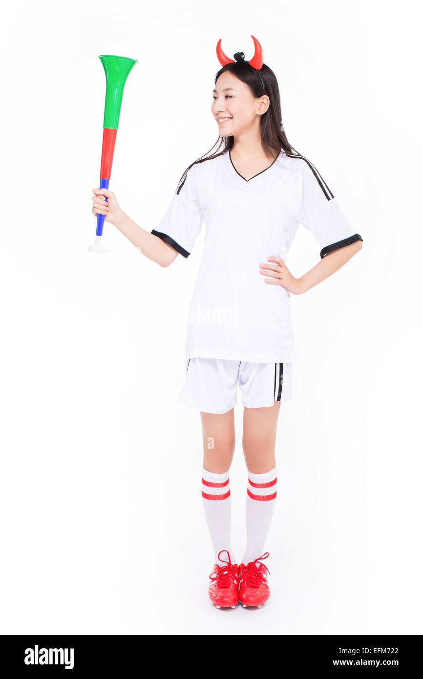 uniformed cheerleader a pose with a megaphone isolated on white Stock ...