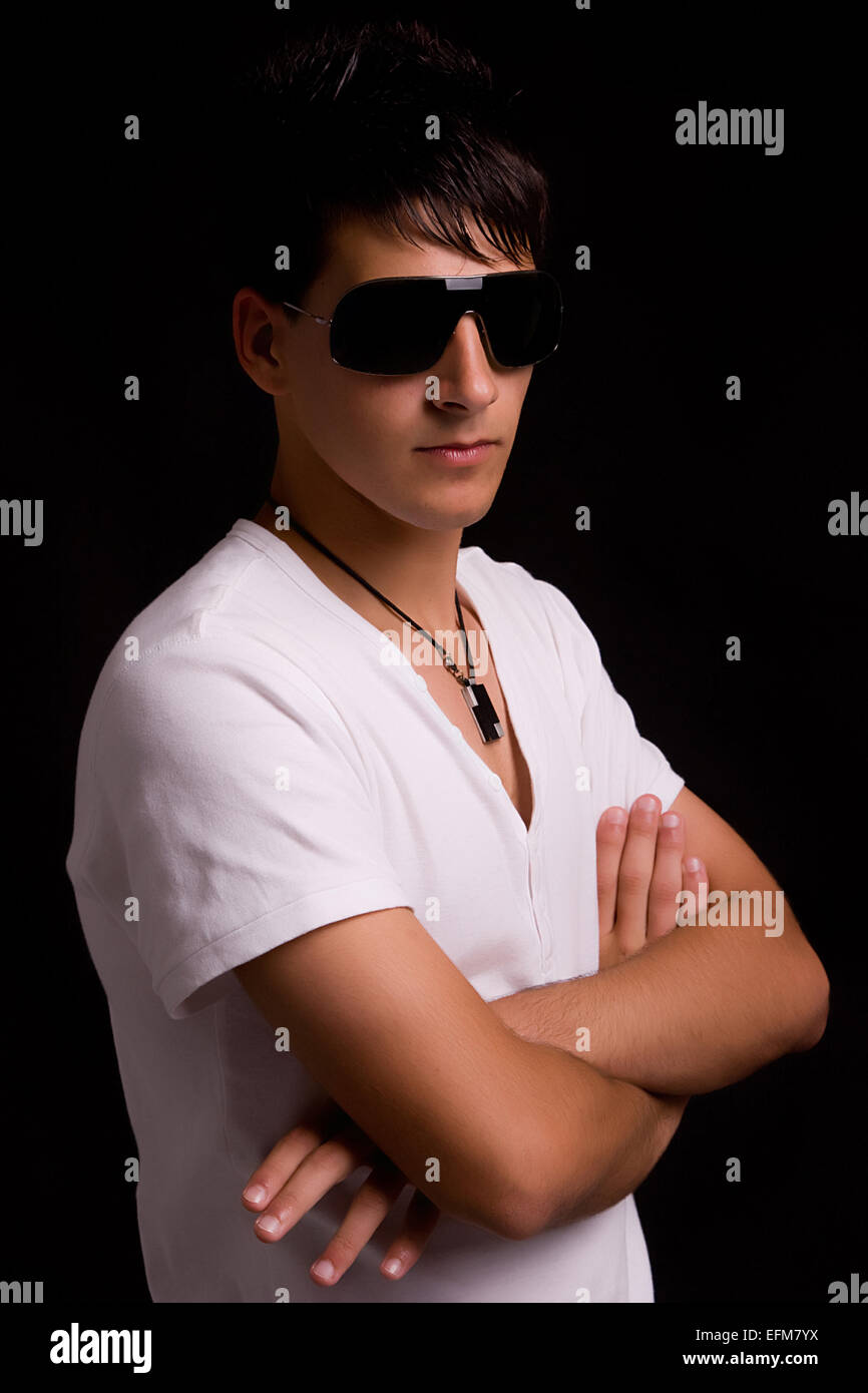 Young boy with sunglasses - low key portrait Stock Photo - Alamy