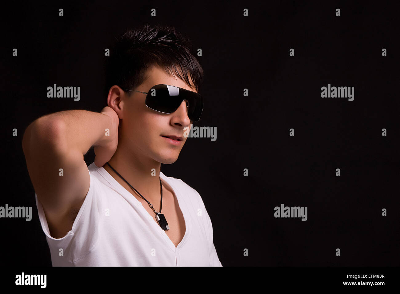 Young boy with sunglasses - low key portrait Stock Photo - Alamy