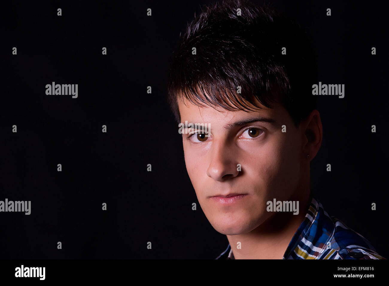 Young boy portrait - low key portrait Stock Photo - Alamy