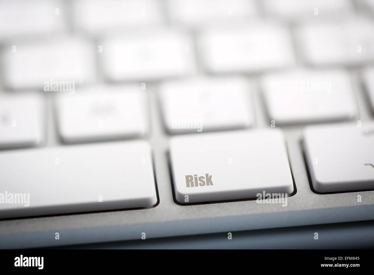 The word "RISK" written on metallic keyboard Stock Photo - Alamy