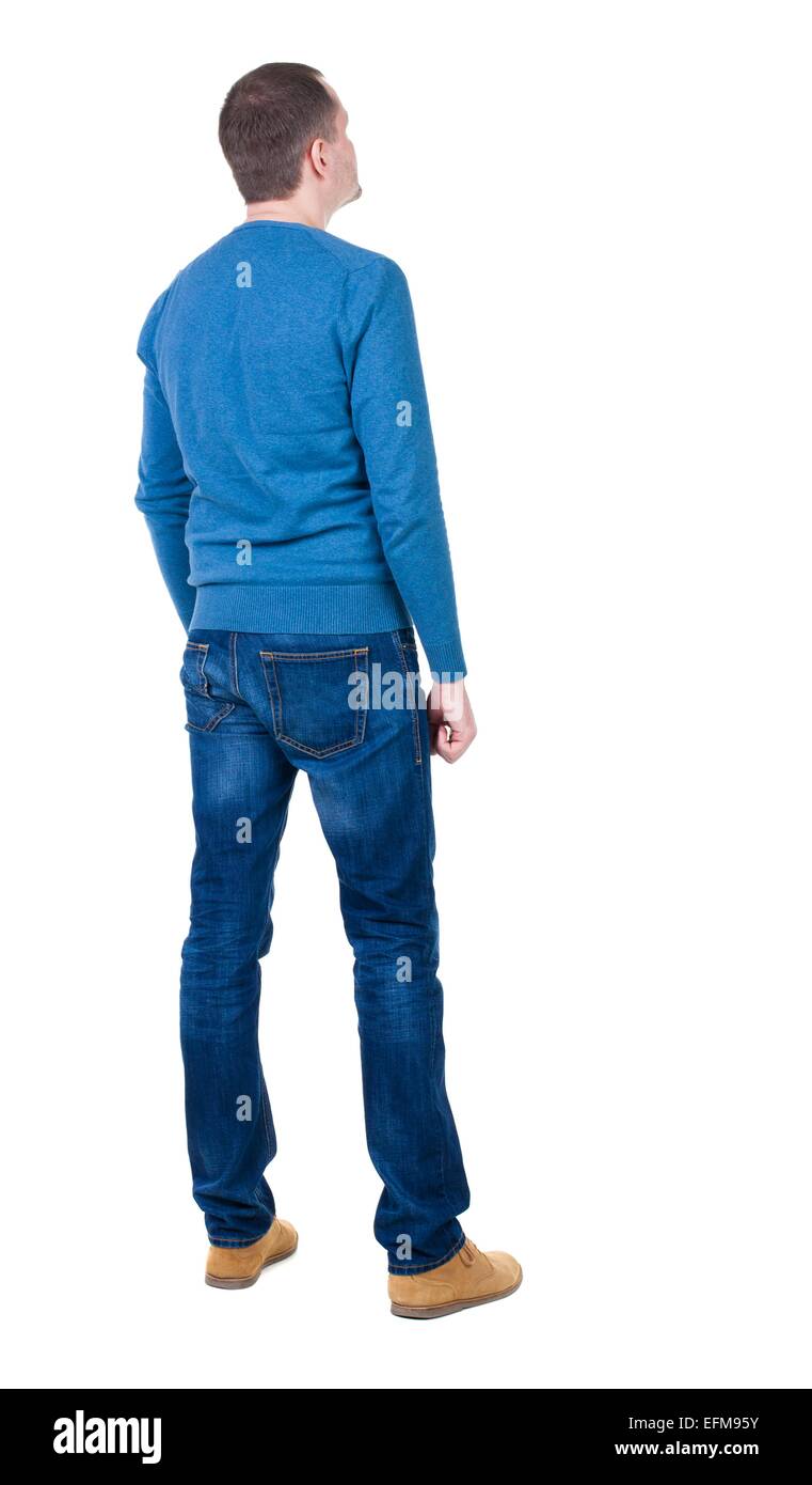 Back view of handsome man in blue pullover. Standing young guy in ...