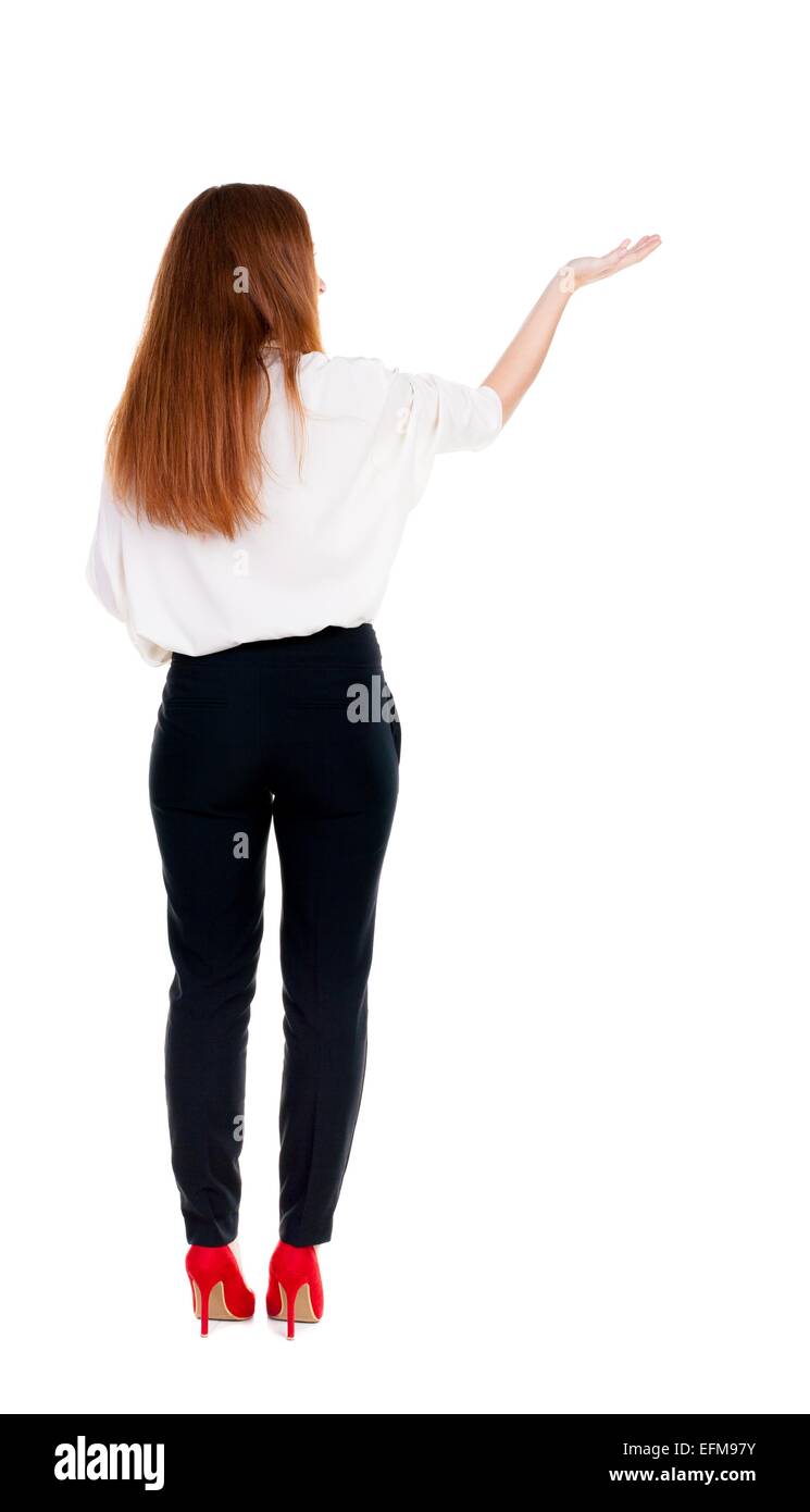Back view of Beautiful business woman in suite looking at wall and ...