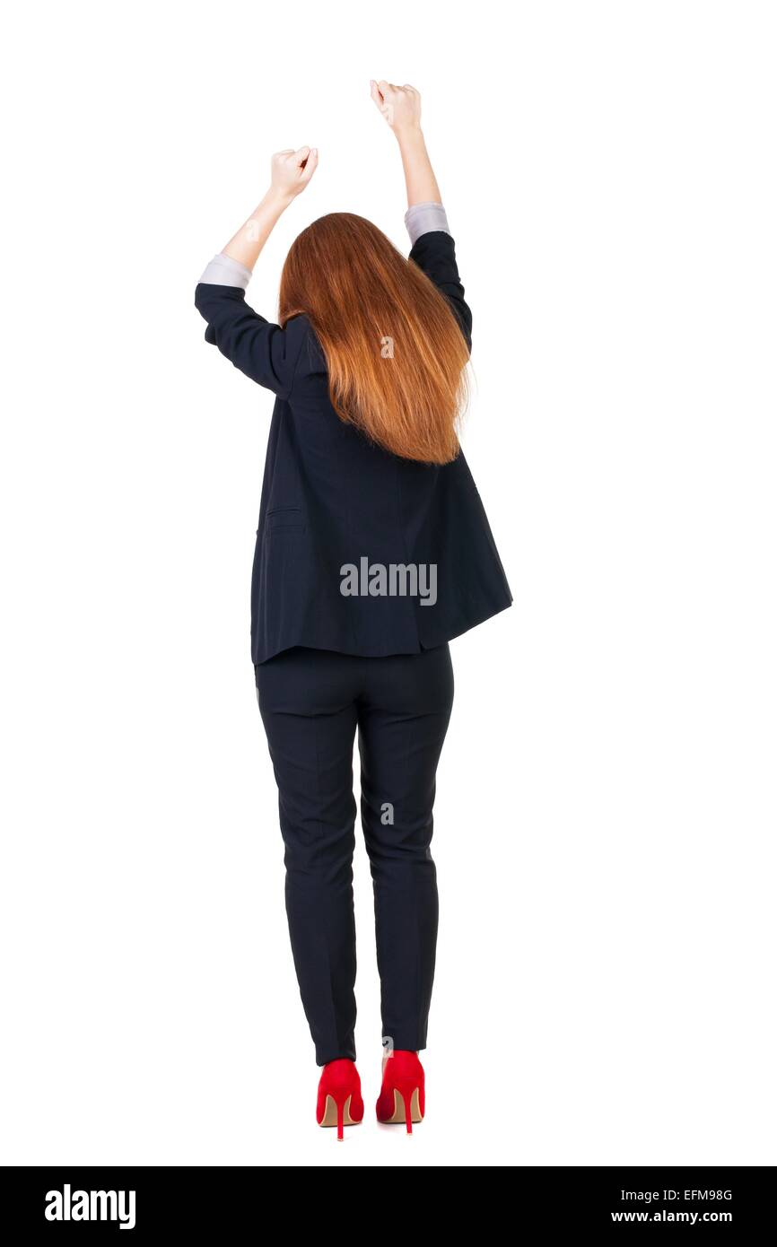 Back view of Beautiful business woman in suite looking at wall and ...