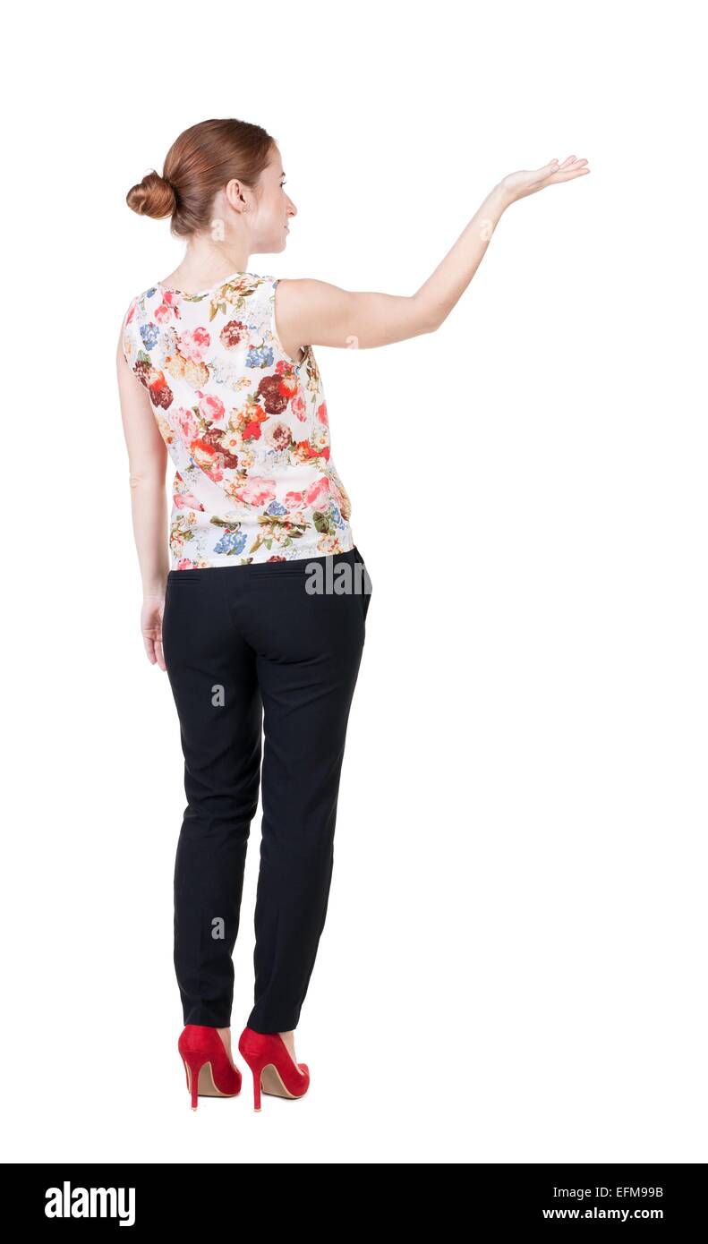 Back view of Beautiful business woman in suite looking at wall and ...