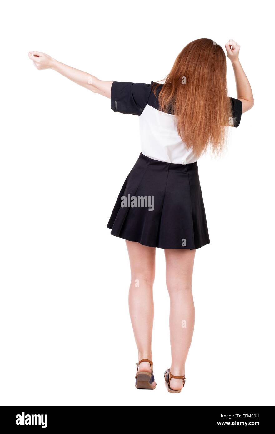 Back view of joyful woman celebrating victory hands up. Rear view ...