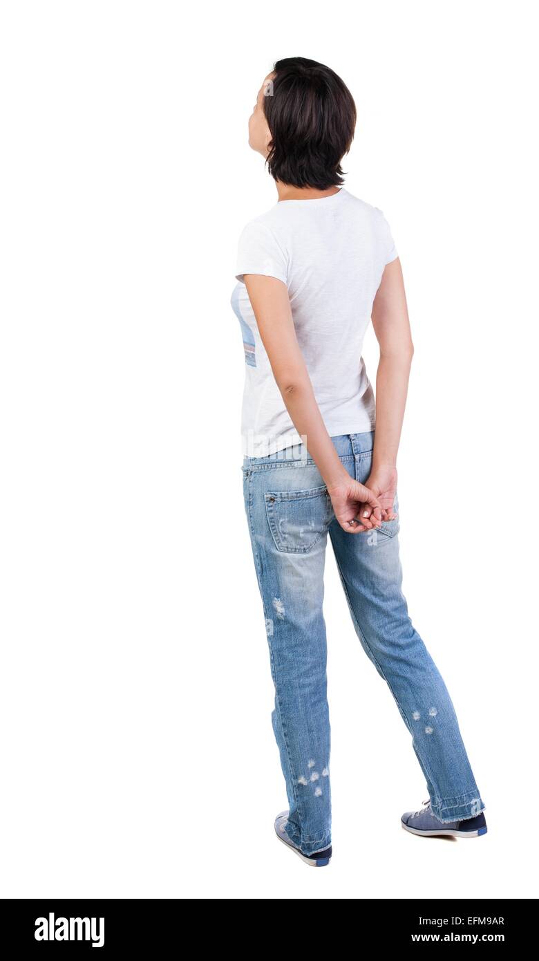 back view of standing young beautiful brunette woman. girl watching ...
