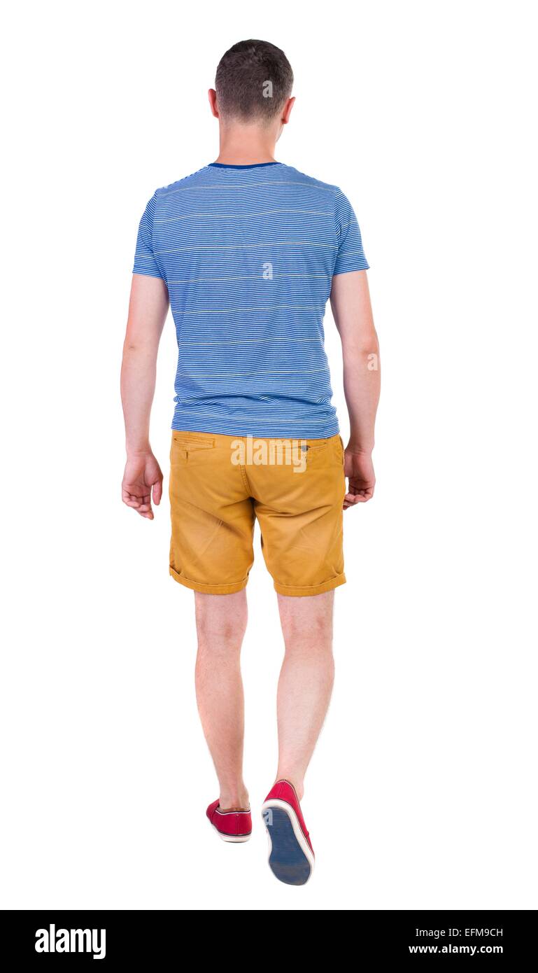 Back view of going handsome man in shorts. walking young guy . Rear ...