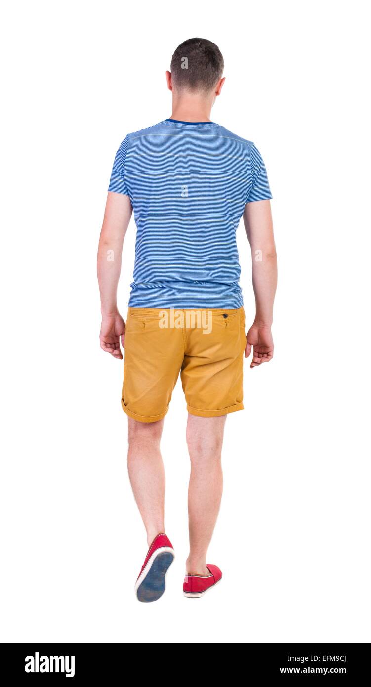 Back view of going handsome man in shorts. walking young guy . Rear ...