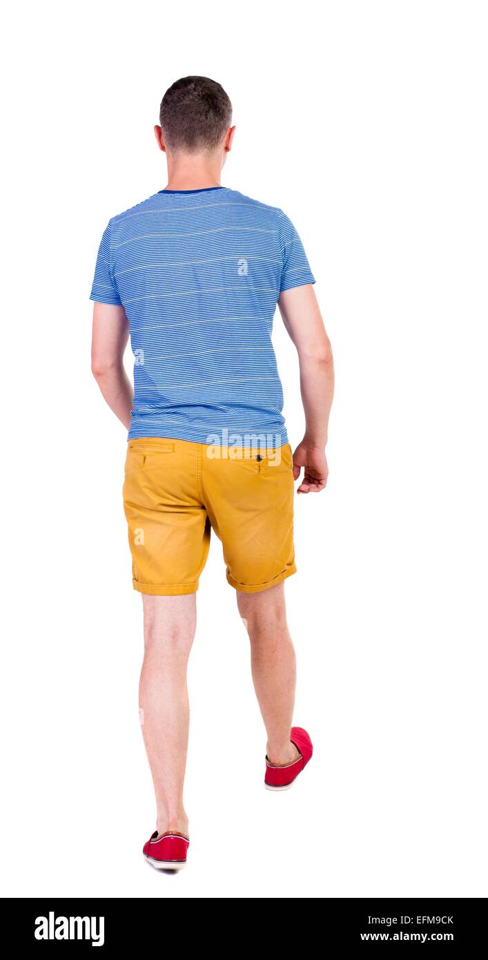 Back view of going handsome man in shorts. walking young guy . Rear ...