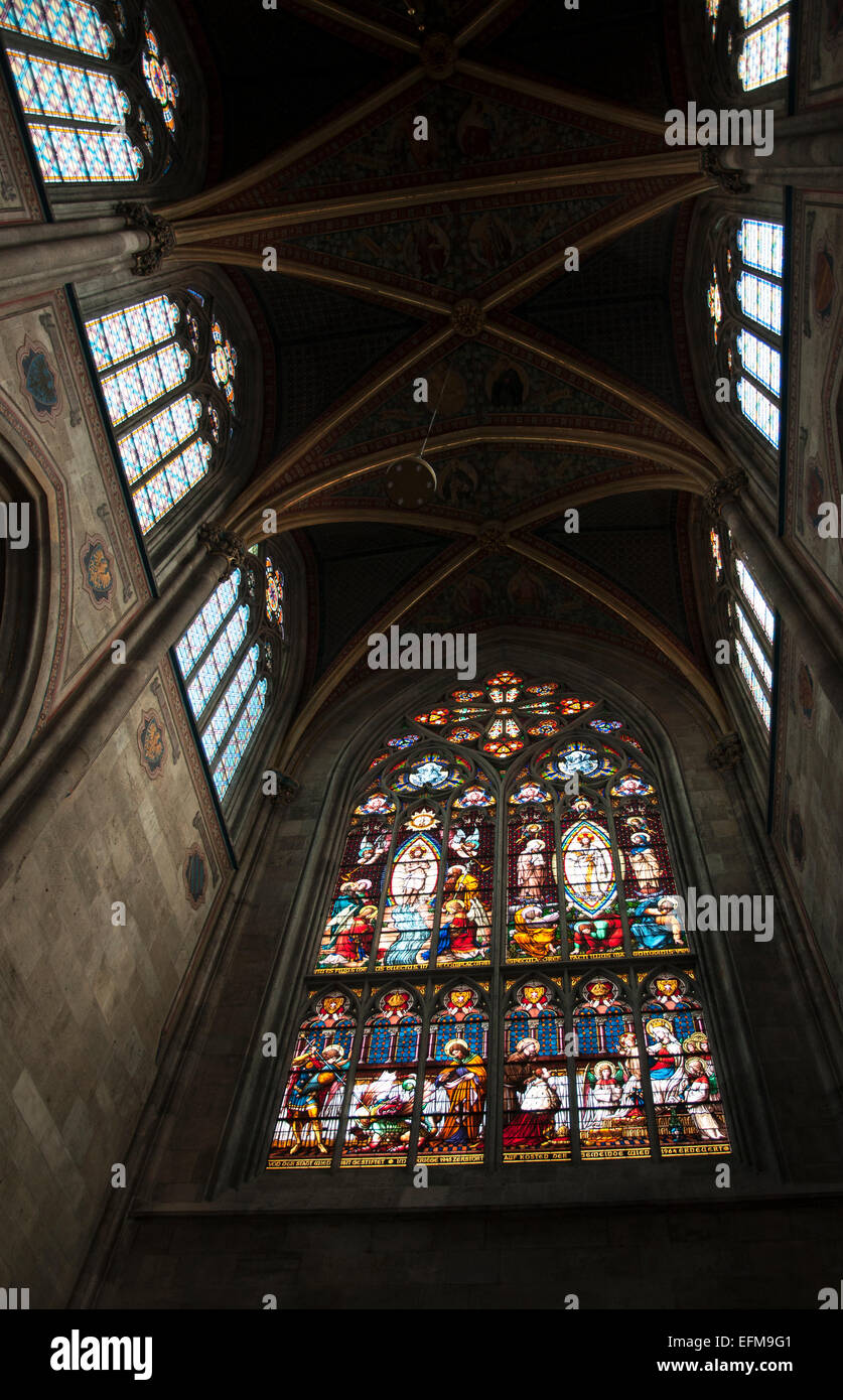 interior view of stained-glass windows and vaulted ceiling of ...