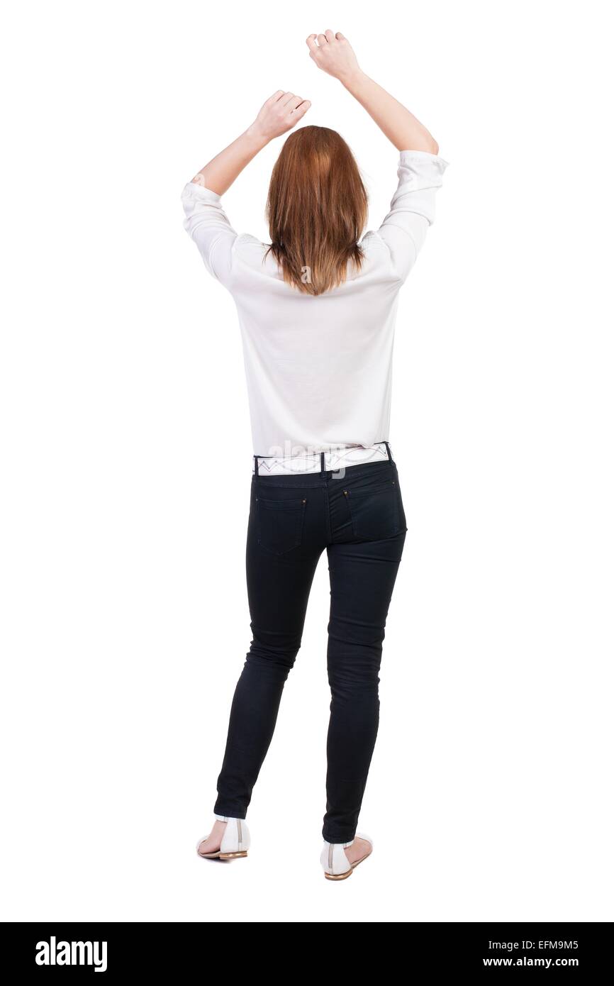 Back view of joyful woman celebrating victory hands up. Rear view ...