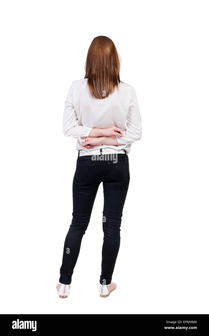 back view of standing young beautiful blonde woman in jeans. girl ...