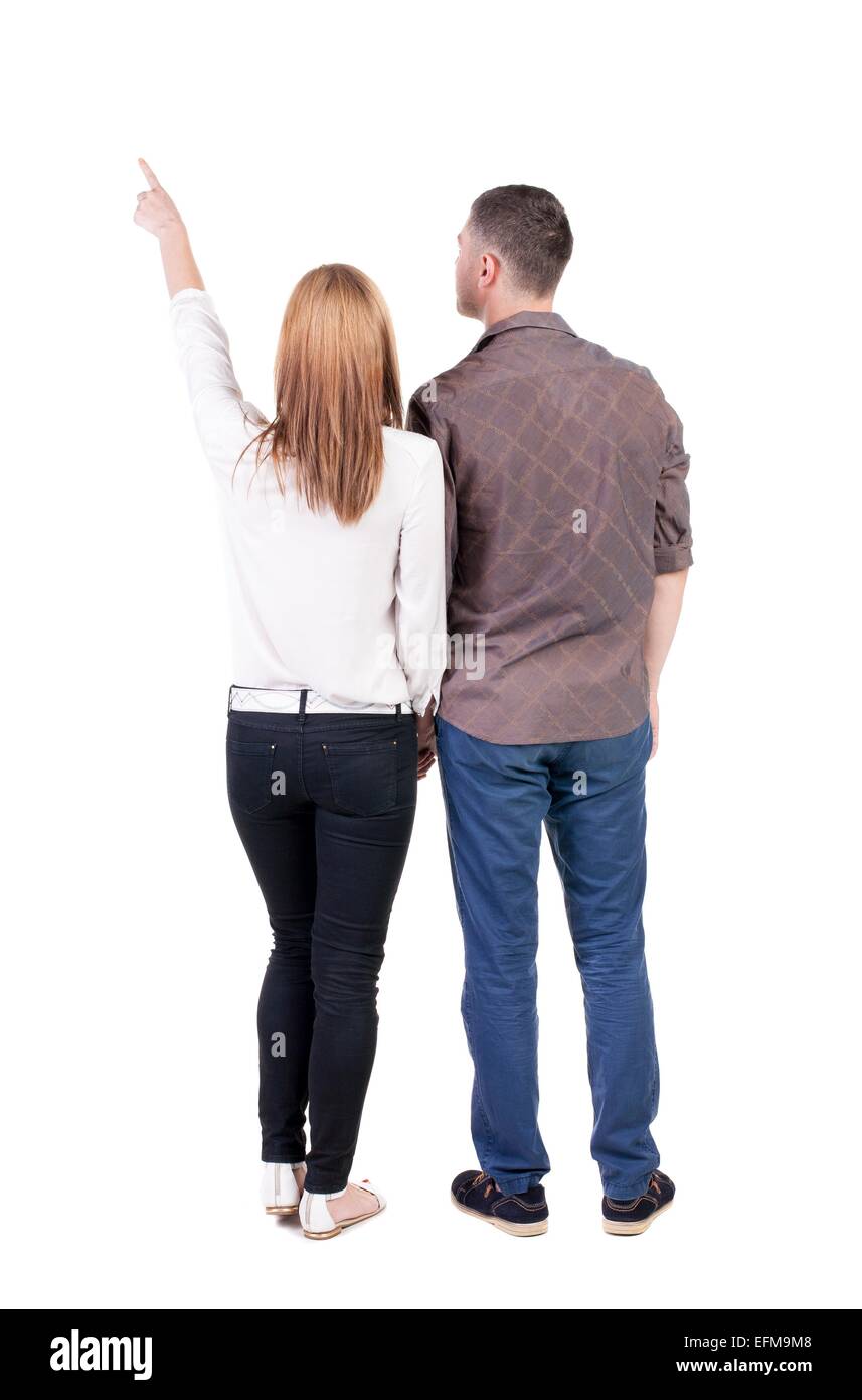young couple pointing. Back view. Rear view people collection. backside ...