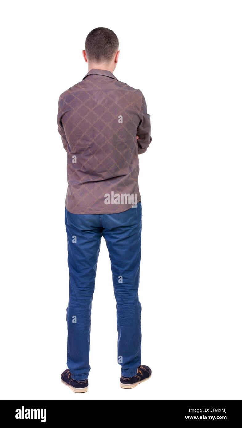 Back view of handsome man in shirt looking up. Standing young guy in ...