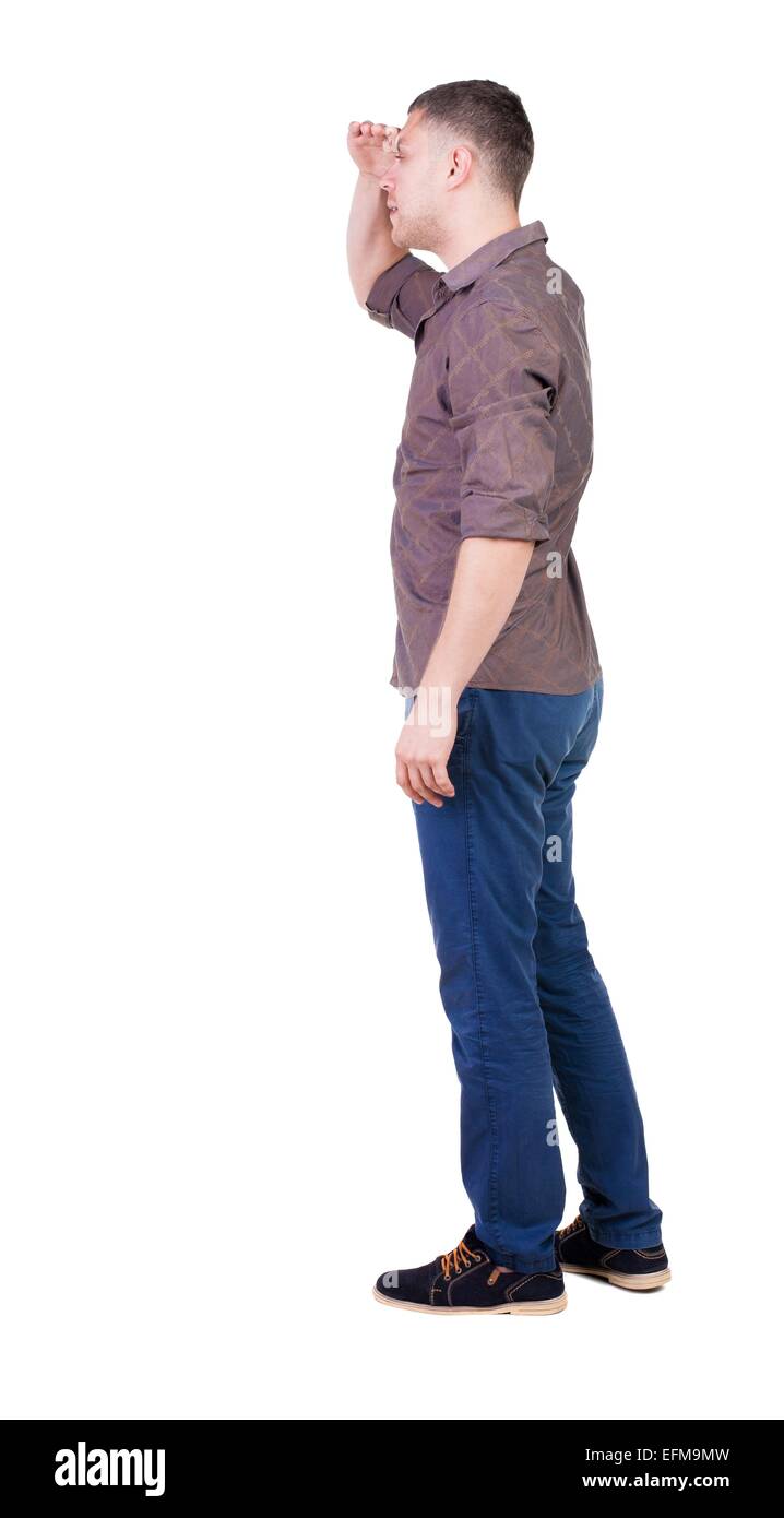 Back view of handsome man in shirt looking up. Standing young guy in ...