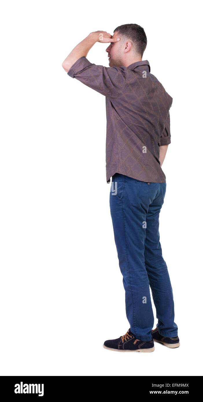 Back view of handsome man in shirt looking up. Standing young guy in ...