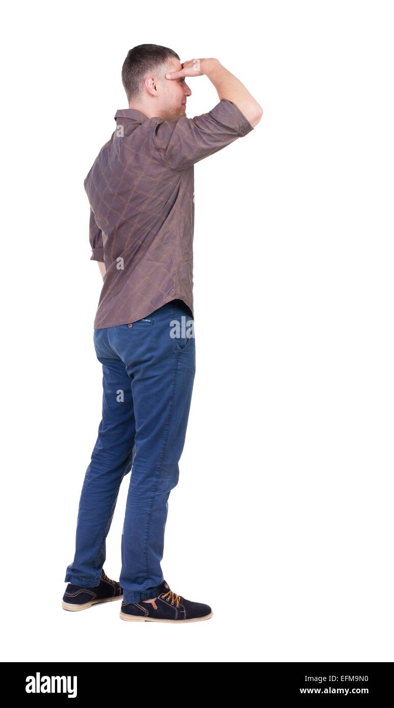 Back view of handsome man in shirt looking up. Standing young guy in ...