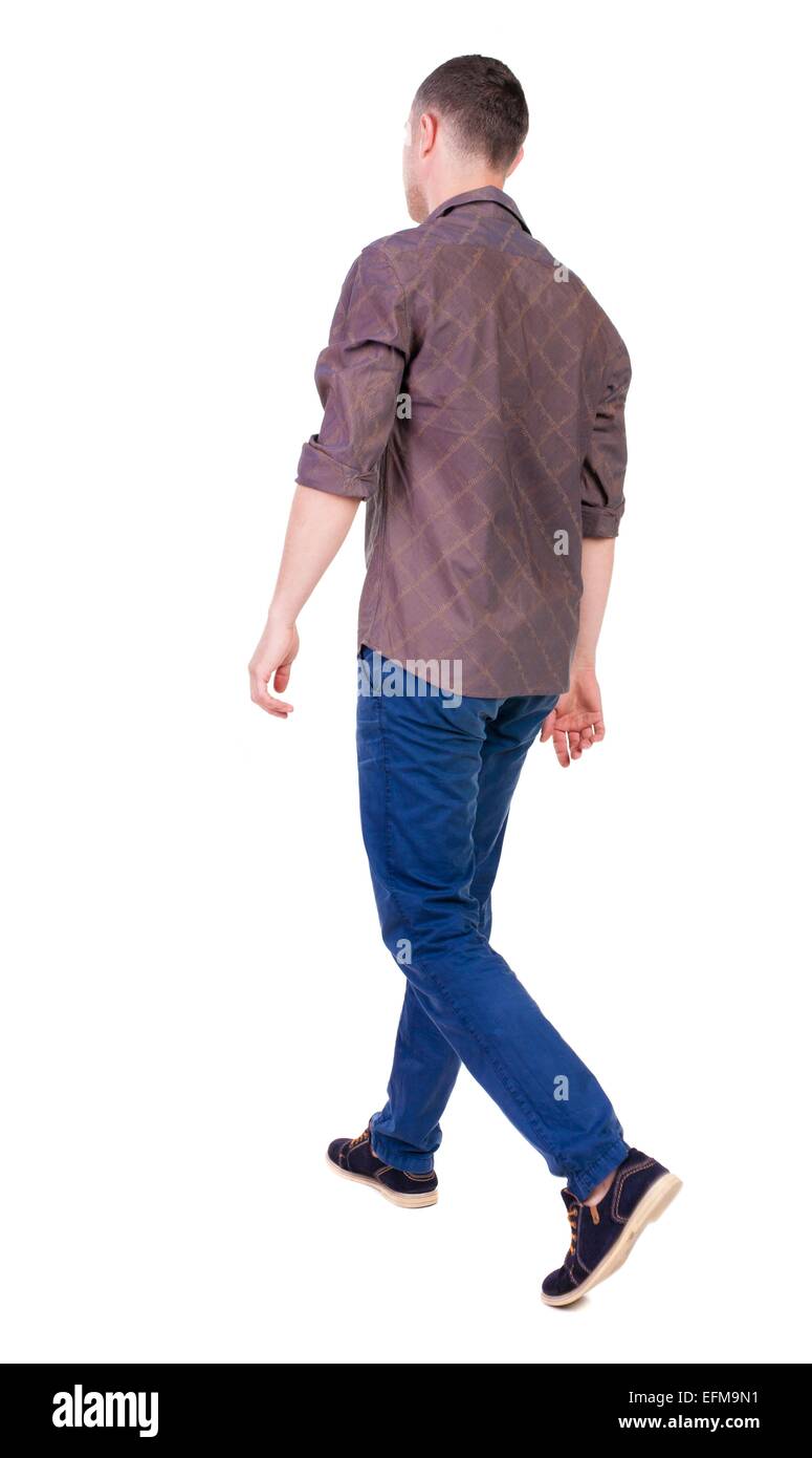 Back view of going handsome man in jeans and a shirt. walking young guy ...