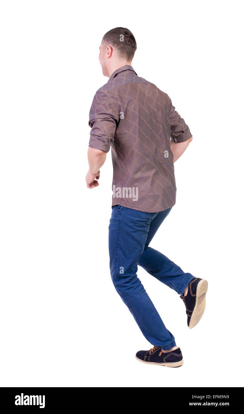 Back view of running man in brown shirt. Walking guy in motion. Rear ...