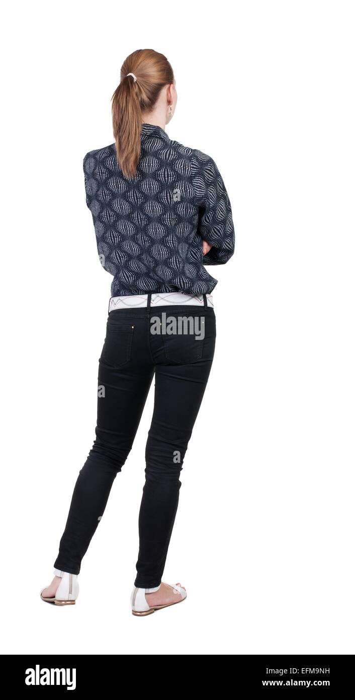 back view of standing young beautiful blonde woman in jeans. girl ...