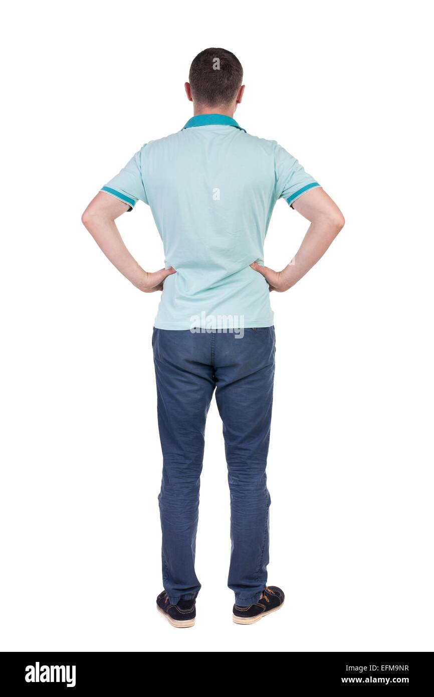 Back view of handsome man in polo looking up. Standing young guy in ...