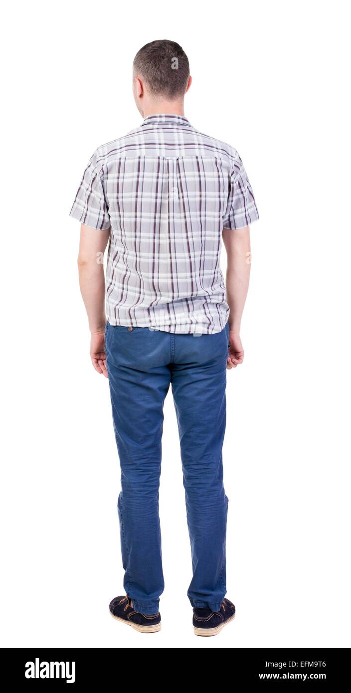 Back view of handsome man in shirt. Standing young guy in jeans. Rear ...