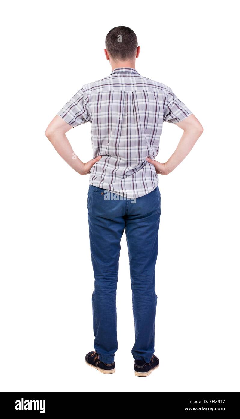 Back view of handsome man in shirt. Standing young guy in jeans. Rear ...