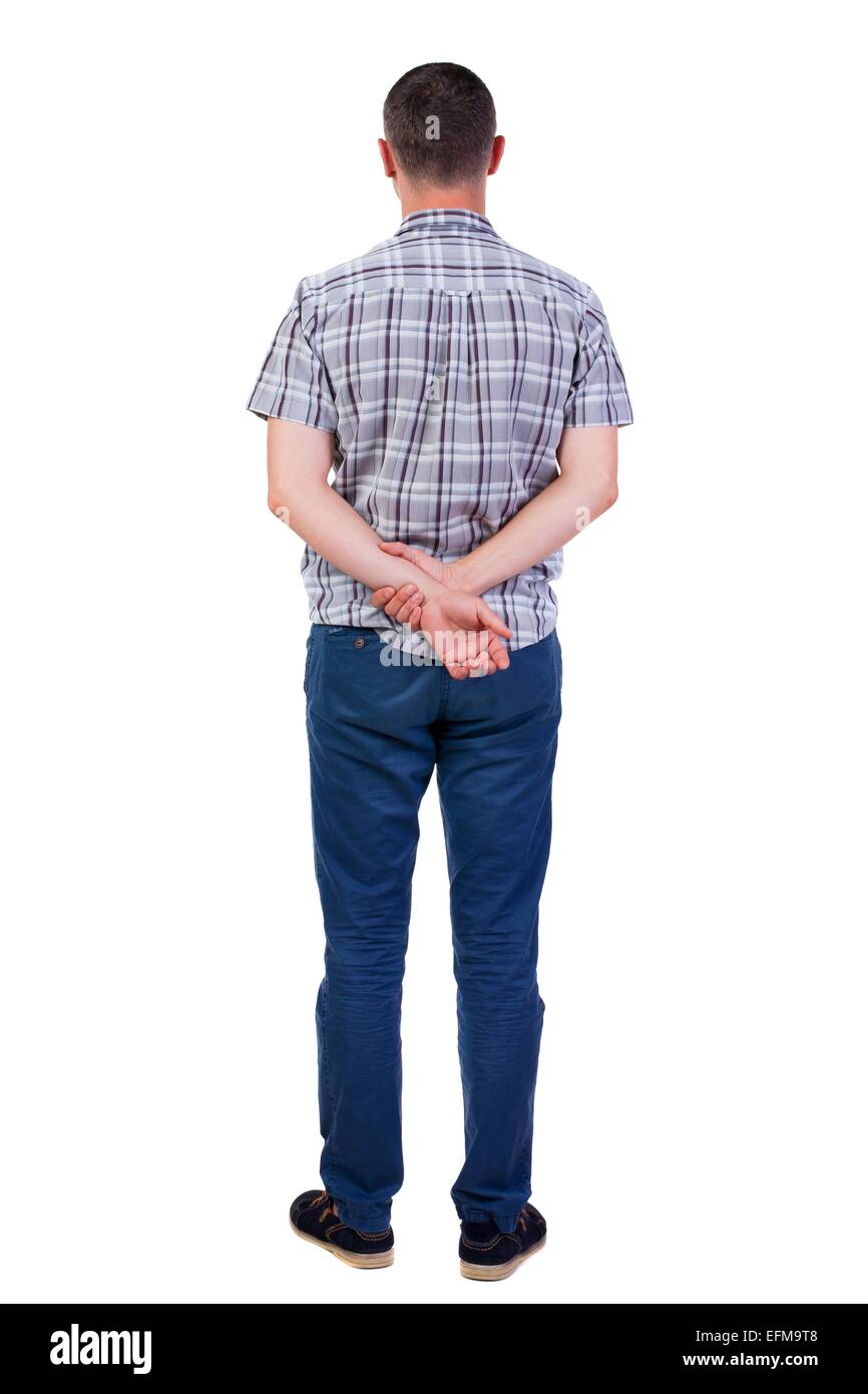 Back view of handsome man in shirt. Standing young guy in jeans. Rear ...