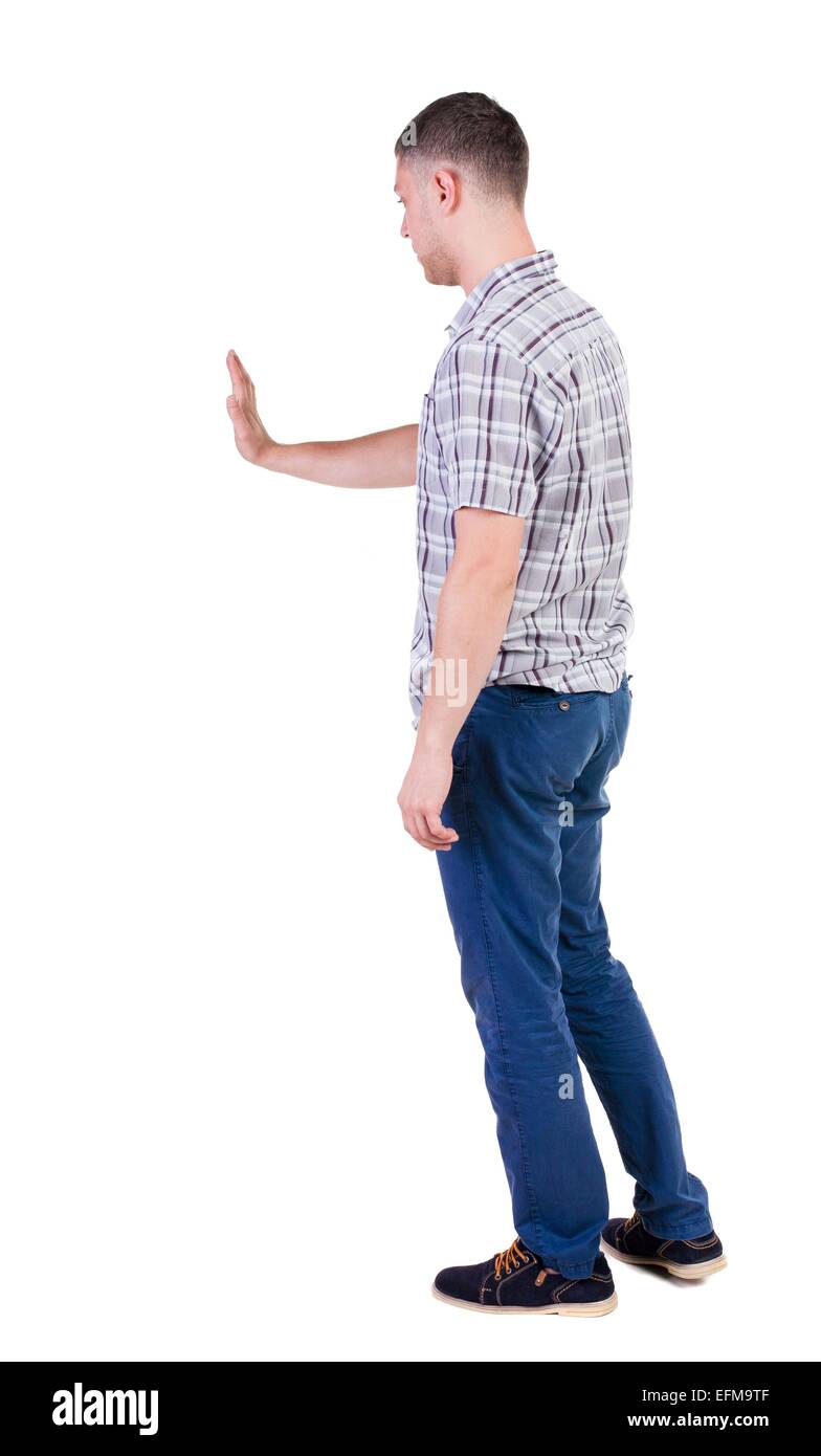 back view of man. Young man jeans presses down on something. Isolated ...