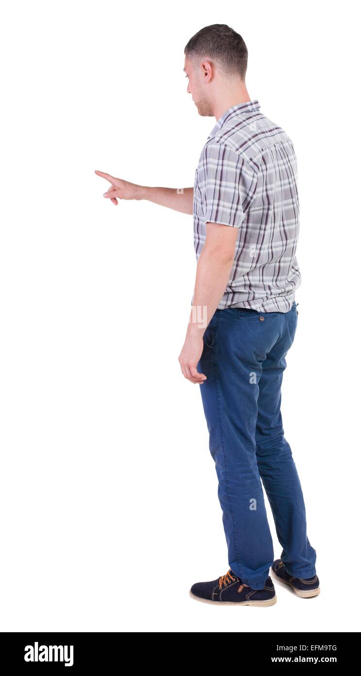 Back view of pointing young men in shirt and jeans. Young guy gesture ...