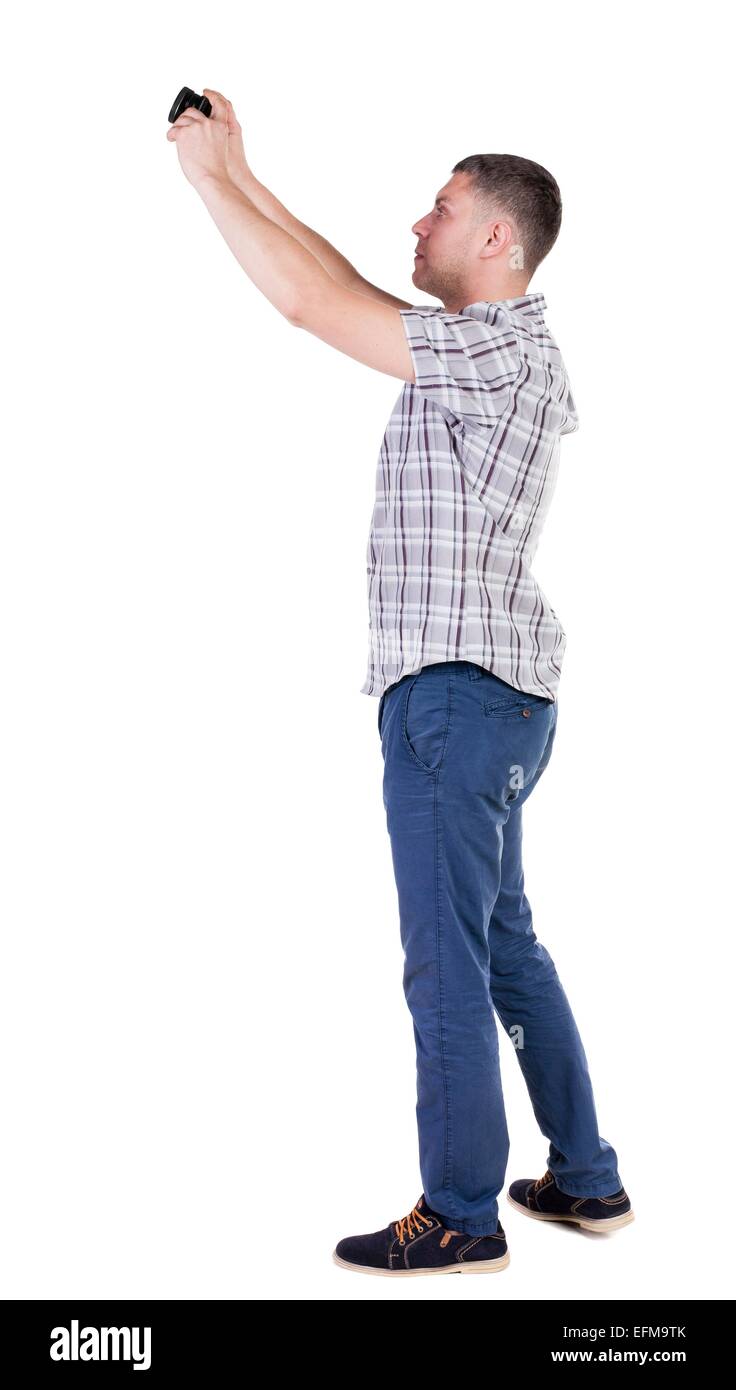 Back view of man photographing. tourist with camera. Rear view people ...